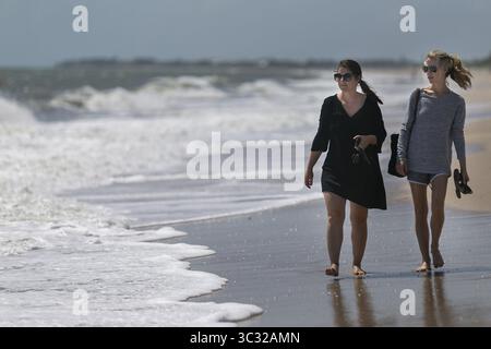 Abbey Stapleton, 29, and her sister-in-law, Ashley Stapleton, 30, walk ...