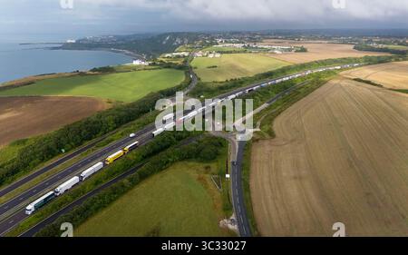 Lorries queue along the A20 outside Dover in Kent as the Port of Dover ...
