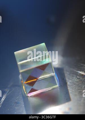 Glass cube prism on a colorful bright surface Stock Photo - Alamy