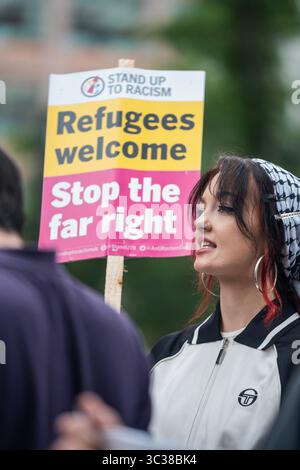 An anti migrant hotel protestor holds a Union flag during the ...