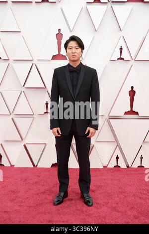 Erick Oh arrives at the Oscars on Sunday, April 25, 2021, at Union ...