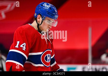Montreal Canadiens' Nick Suzuki (14) congratulates Carolina Hurricanes ...