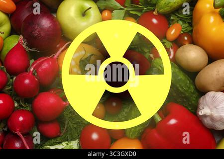 Fresh vegetables and radioactive sign. Environmental contamination ...