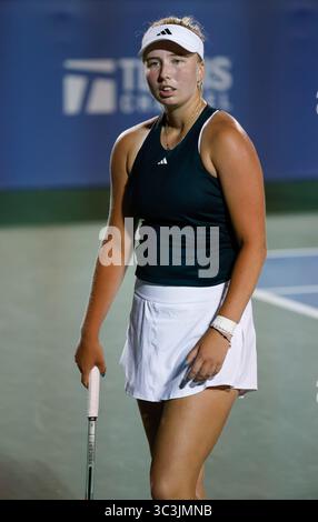 July 25, 2025: Clara Tauson hits a shot in her match against Anna ...