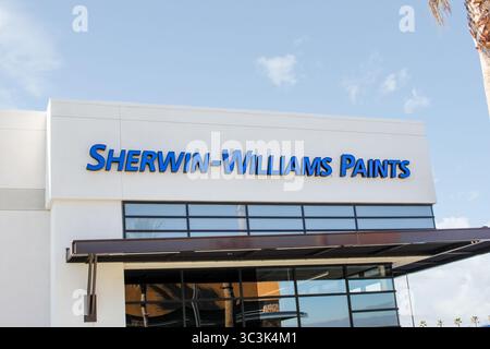 Sherwin-Williams Paints sign on exterior of white building under clear ...