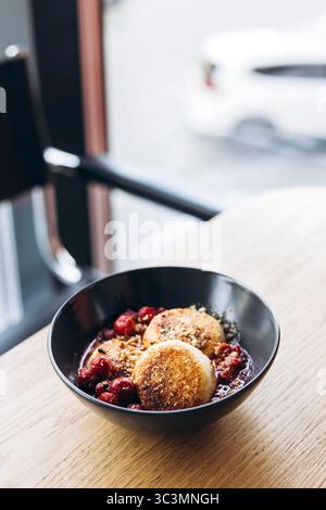 cheesecakes for breakfast with berries in a restaurant Stock Photo - Alamy