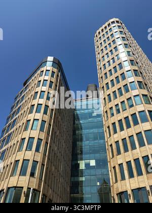 Modern Moscow City towers against a blue sky. Tall glass skyscrapers ...