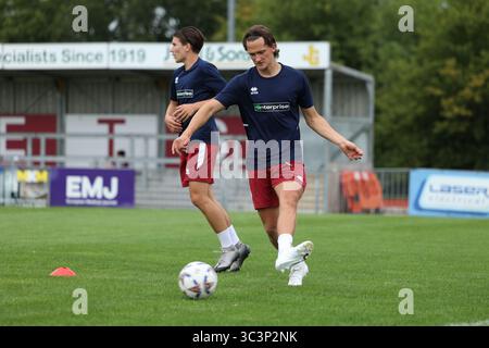 Harry Barbrook, of Chelmsford City warming up ahead of the match ...