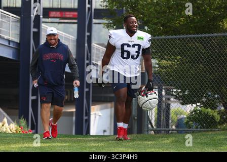 New England Patriots guard Mehki Butler (63) walks with defensive ...