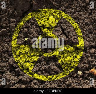 Yellow radioactive sign on soil, top view. Radiological pollution Stock ...