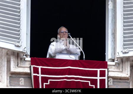 Pope Leo XIV leads the Angelus prayer from the window of the Apostolic ...