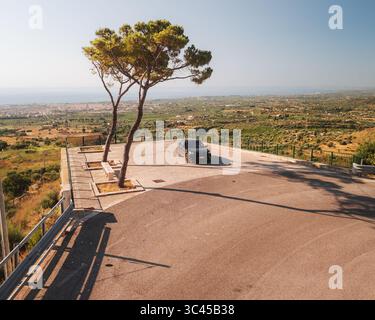 car parked near cliff edge in usa california with blue sky and sea ...