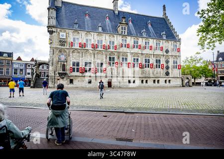 GOUDA - Walking on the street with a person in a wheelchair ROBIN ...