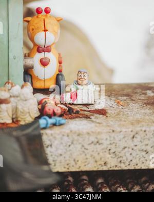 Traditional stone statues and decorative figurines inside the courtyard ...