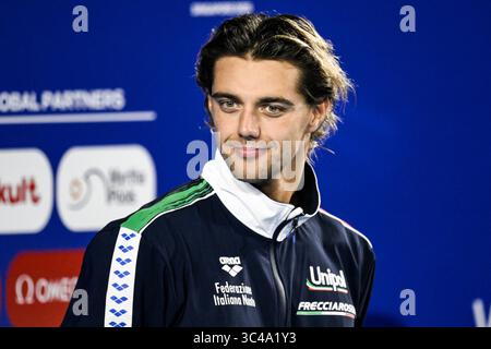 Thomas Ceccon of Italy, bronze, attends the medal ceremony of the swimming 50m Butterfly Men ...