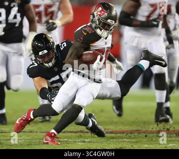 Jacksonville Jaguars linebacker Nick DeLuca walks to the field at an ...