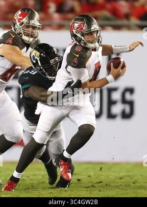 Jacksonville Jaguars defensive tackle Austin Johnson (99) leaves the ...