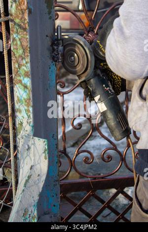 Builder working with angle grinder Stock Photo - Alamy