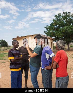 Young african man working as volunteer t shirt at donations stand ...