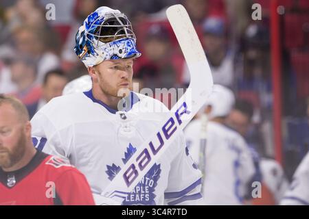 Toronto Maple Leafs goaltender Frederik Andersen plays the puck ahead ...