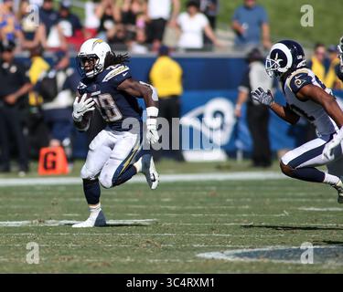 Los Angeles Chargers running back Omarion Hampton, left, runs with the ...