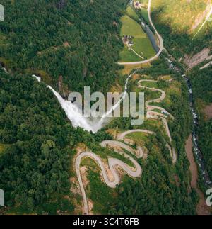 Aerial view of winding roads carving through the rugged terrain of ...