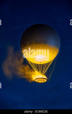 Paris, France - 07 28 2025: View the Olympic Cauldron flying throught ...