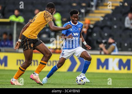 Simon Adingra of Sunderland breaks with the ball under pressure from ...