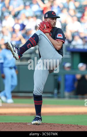 Cleveland Guardians starting pitcher Tanner Bibee reaches out for the ...