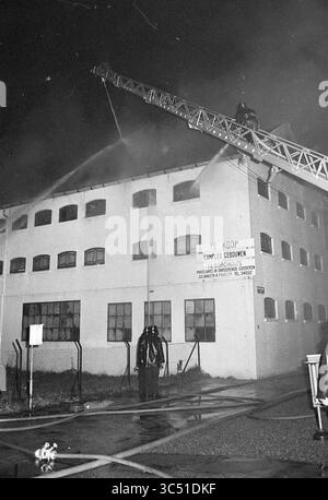 Firefighters battle a large industrial fire at Magnablend in Waxahachie ...