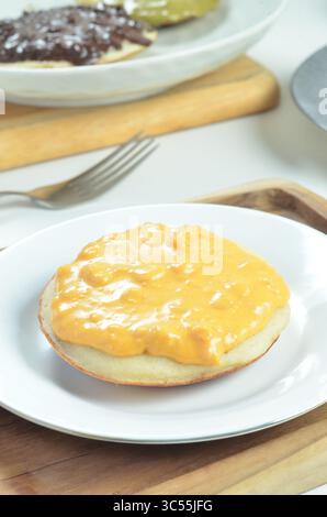 Serabi with cheese pasta topping, a traditional Indonesian snack Stock ...