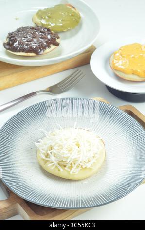 Serabi with grated cheese topping, a traditional Indonesian snack Stock ...