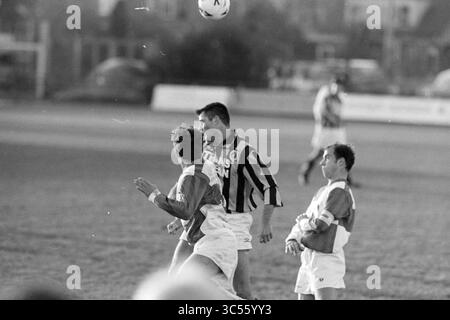 High energy soccer action featuring a young athlete jumping over an ...