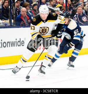 Columbus Blue Jackets' Charlie Coyle (3) celebrates with Mathieu ...
