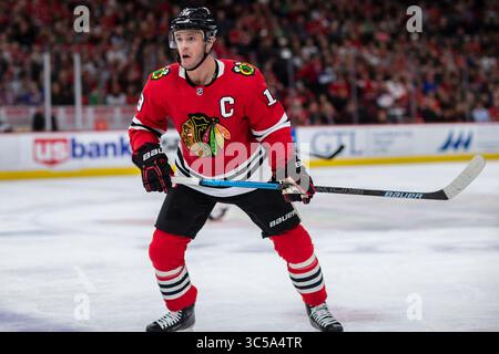 Winnipeg Jets' Jonathan Toews (19) redirects the puck past Vancouver ...