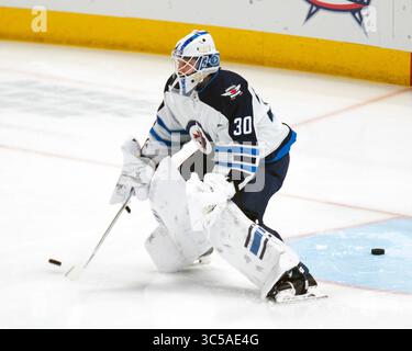 Winnipeg Jets goaltender Laurent Brossoit (39) makes a save on Toronto ...