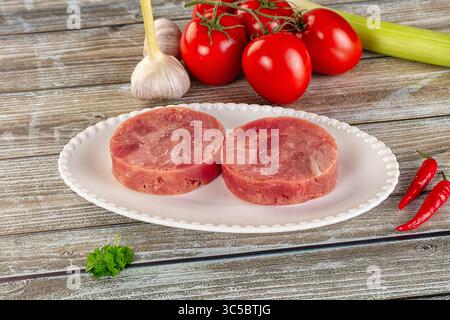 Raw round tuna fish uncucked fillet Stock Photo - Alamy