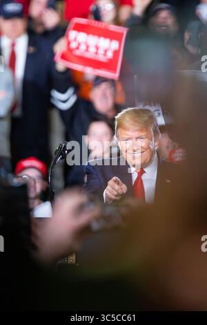 President Donald Trump points to the new Air Force One before speaking ...