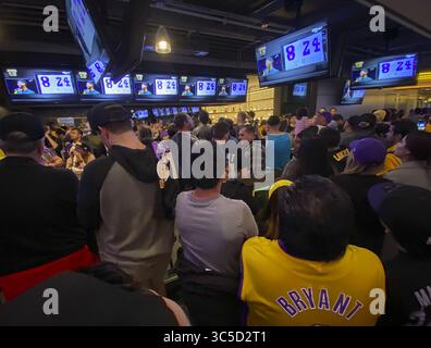 Basketball fans watch during the first half of an NBA basketball game ...