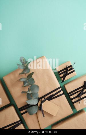 Gift boxes with ribbons on mint background Stock Photo - Alamy