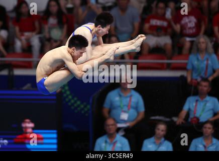 Cheng Zilong and Li Yajie of China compete in the mixed 3m synchronised ...