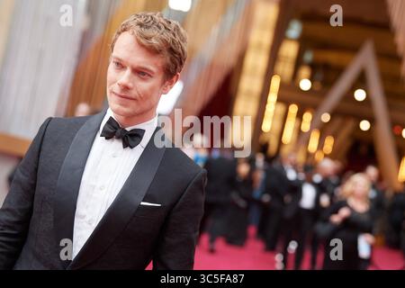 Alfie Allen arrives at the Oscars on Sunday, Feb. 9, 2020, at the Dolby ...