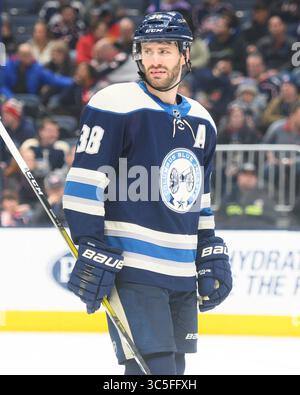 Columbus Blue Jackets center Boone Jenner (38) gets congratulations ...