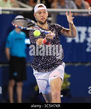 Jack Sock returns to Radu Albot, of Moldova, during the Delray Beach ...