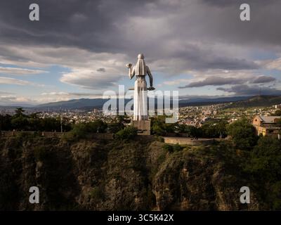 Aerial view of the majestic Kartlis Deda statue stands sentinel atop ...