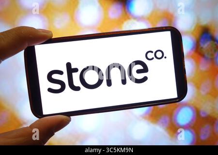 In this photo illustration, the logo of StoneCo is displayed on the ...