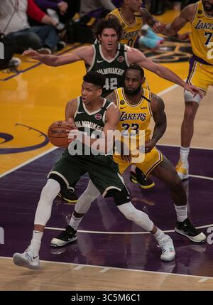 Milwaukee Bucks' Giannis Antetokounmpo tries to drive past Los Angeles ...