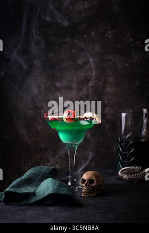 Spooky green Halloween cocktail with eyeball Stock Photo - Alamy