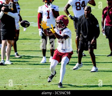 Washington Commanders wide receiver Chris Moore (19) takes down Las ...