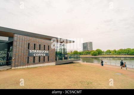 Toyama, Japan - 10 may 2025 Starbucks in Fuganuga Kansui Park . High ...